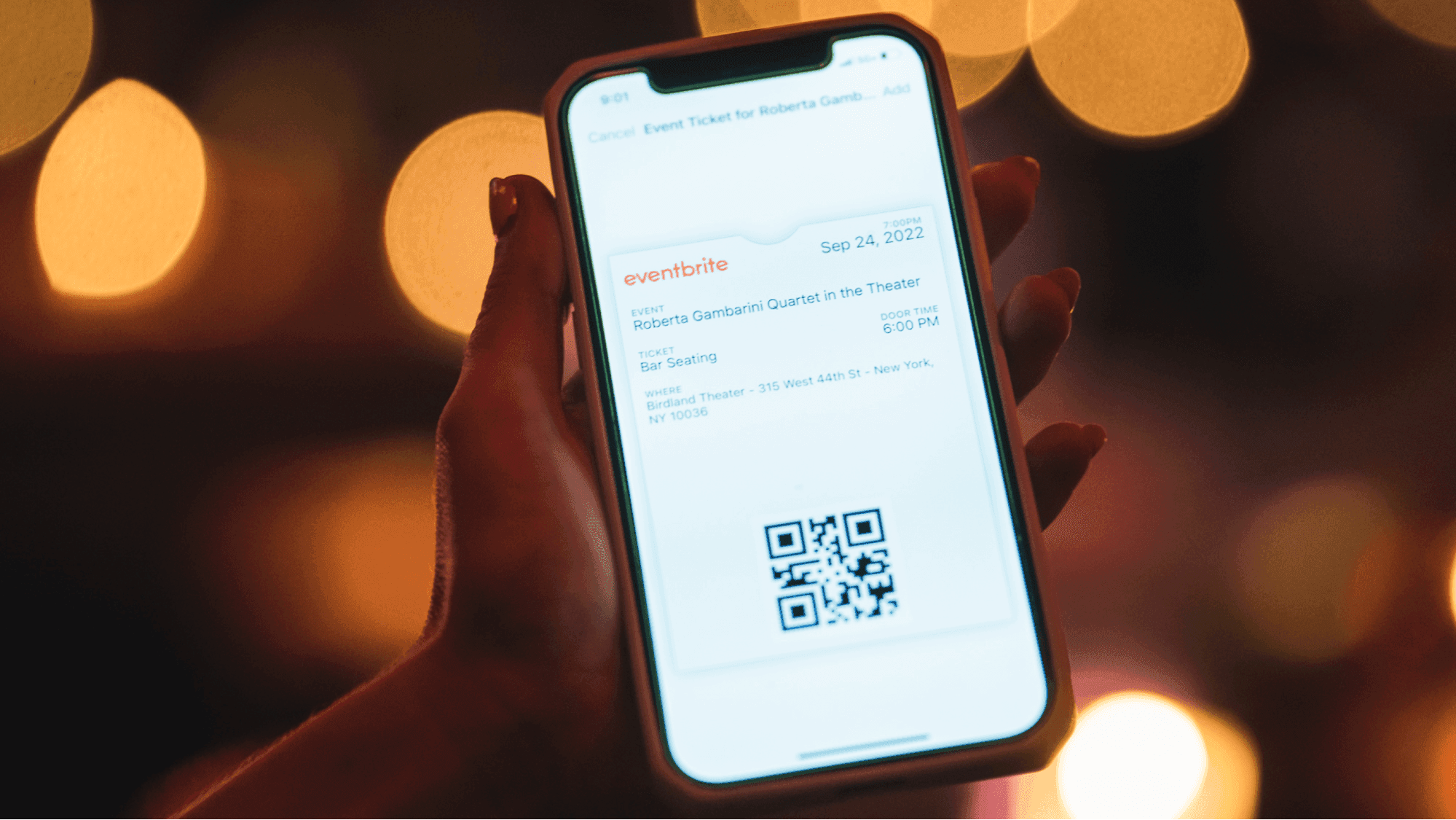Staff scanning digital tickets at event venue entrance